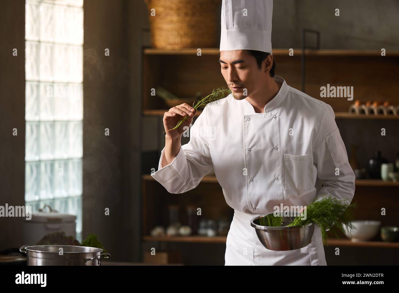Cook making dishes in the kitchen Stock Photo - Alamy