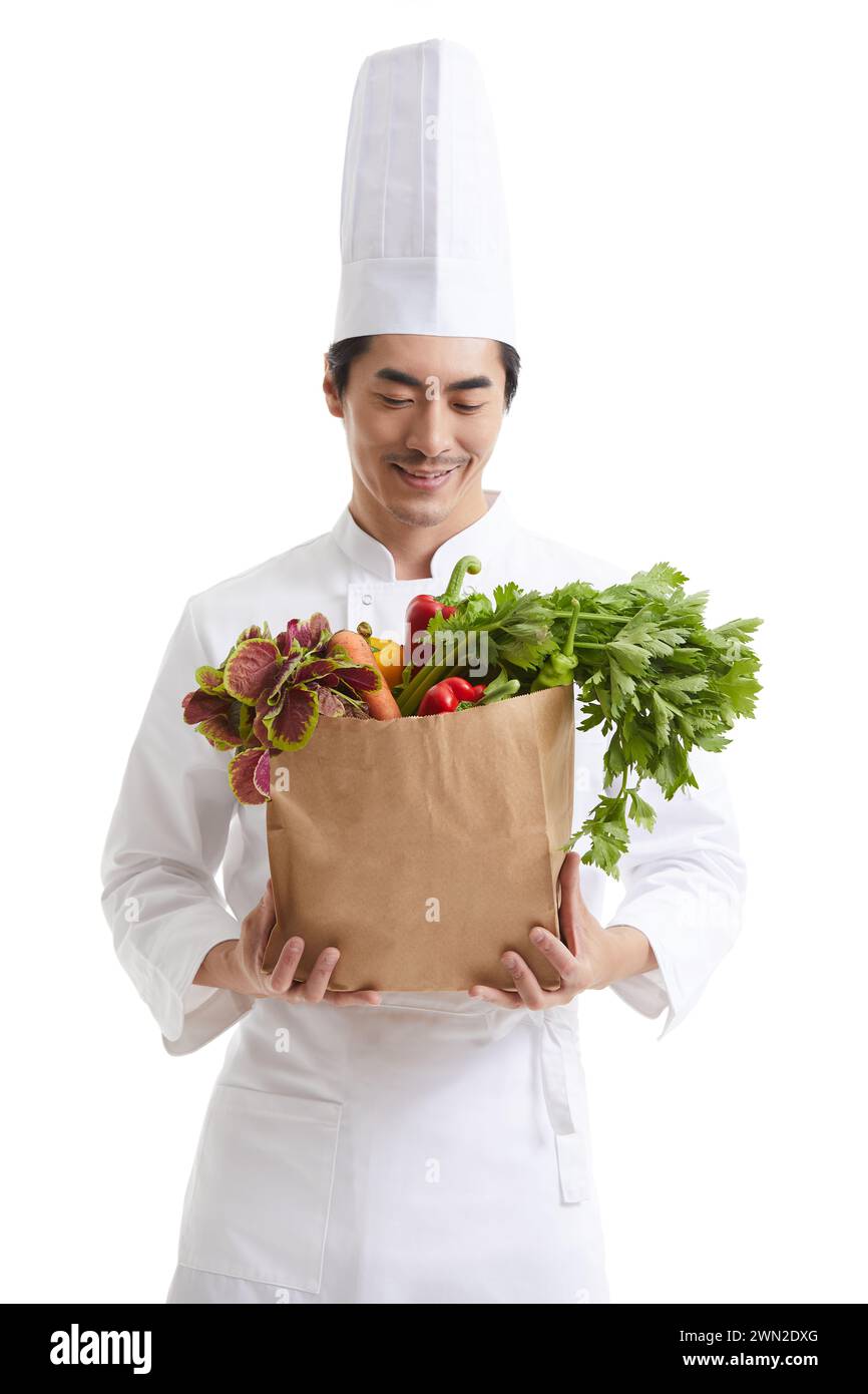 Cook making dishes in the kitchen Stock Photo - Alamy