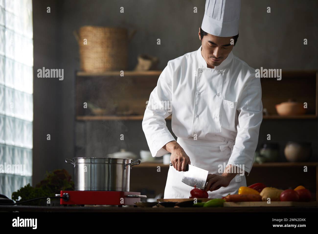 Cook making dishes in the kitchen Stock Photo - Alamy