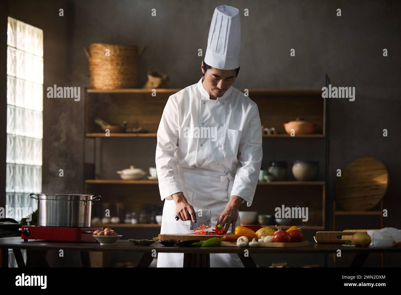 Cook making dishes in the kitchen Stock Photo - Alamy