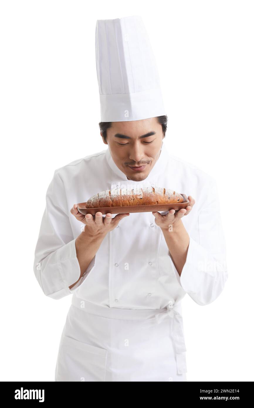 Chef with a loaf of bread Stock Photo - Alamy