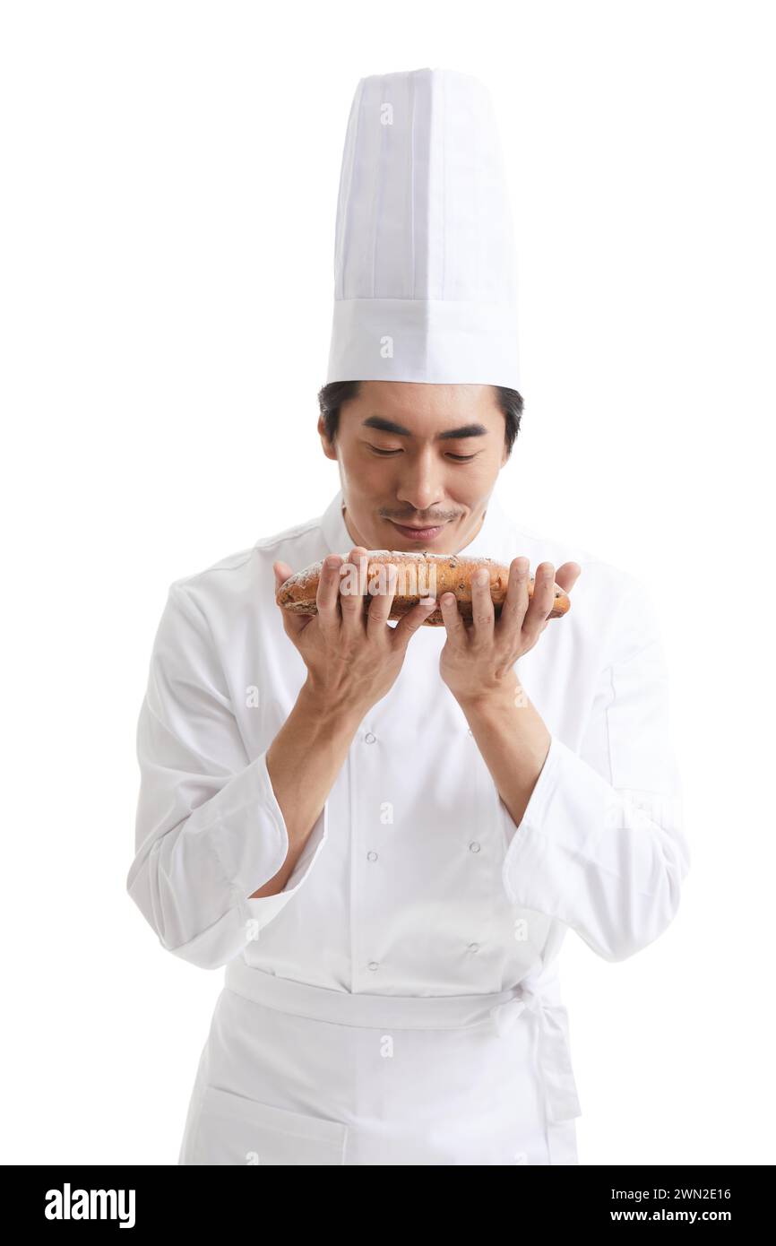 Chef with a loaf of bread Stock Photo - Alamy