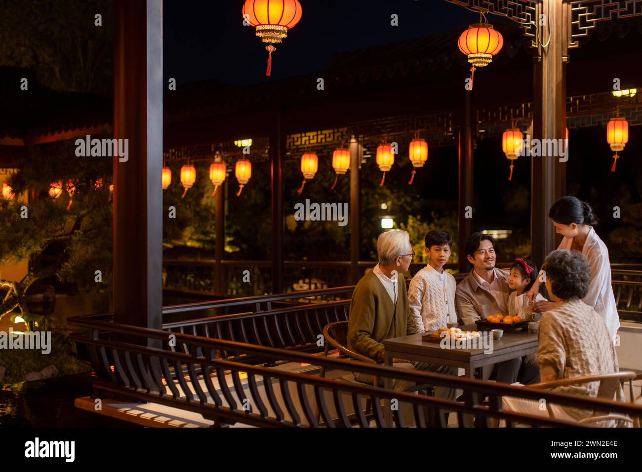 Happy Family Celebrating Mid-Autumn Festival Stock Photo - Alamy