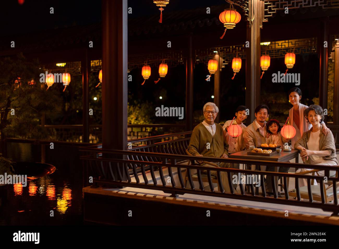 Happy Family Celebrating Mid-Autumn Festival Stock Photo - Alamy