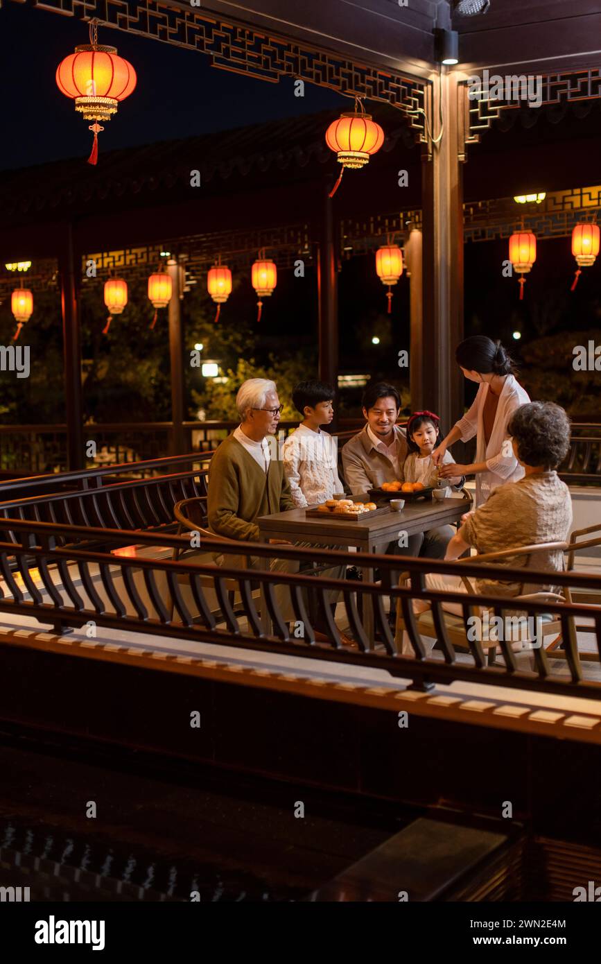 Happy Family Celebrating Mid-Autumn Festival Stock Photo - Alamy