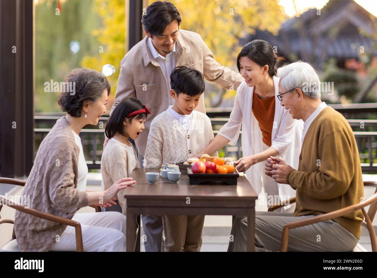 Happy Family Celebrating Mid-Autumn Festival Stock Photo - Alamy