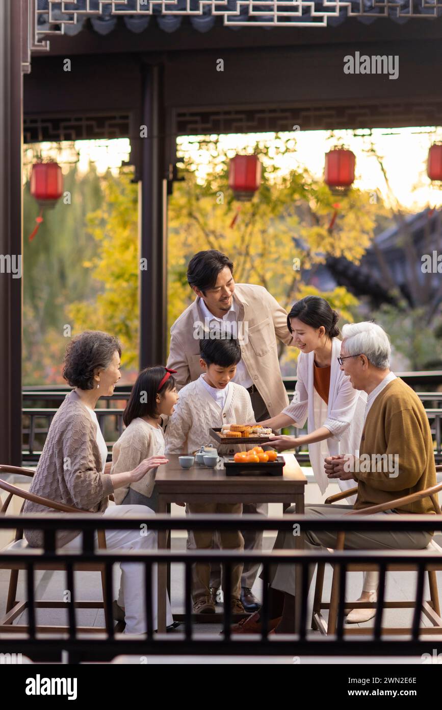 Happy Chinese Family Celebrating Mid-Autumn Festival Stock Photo - Alamy