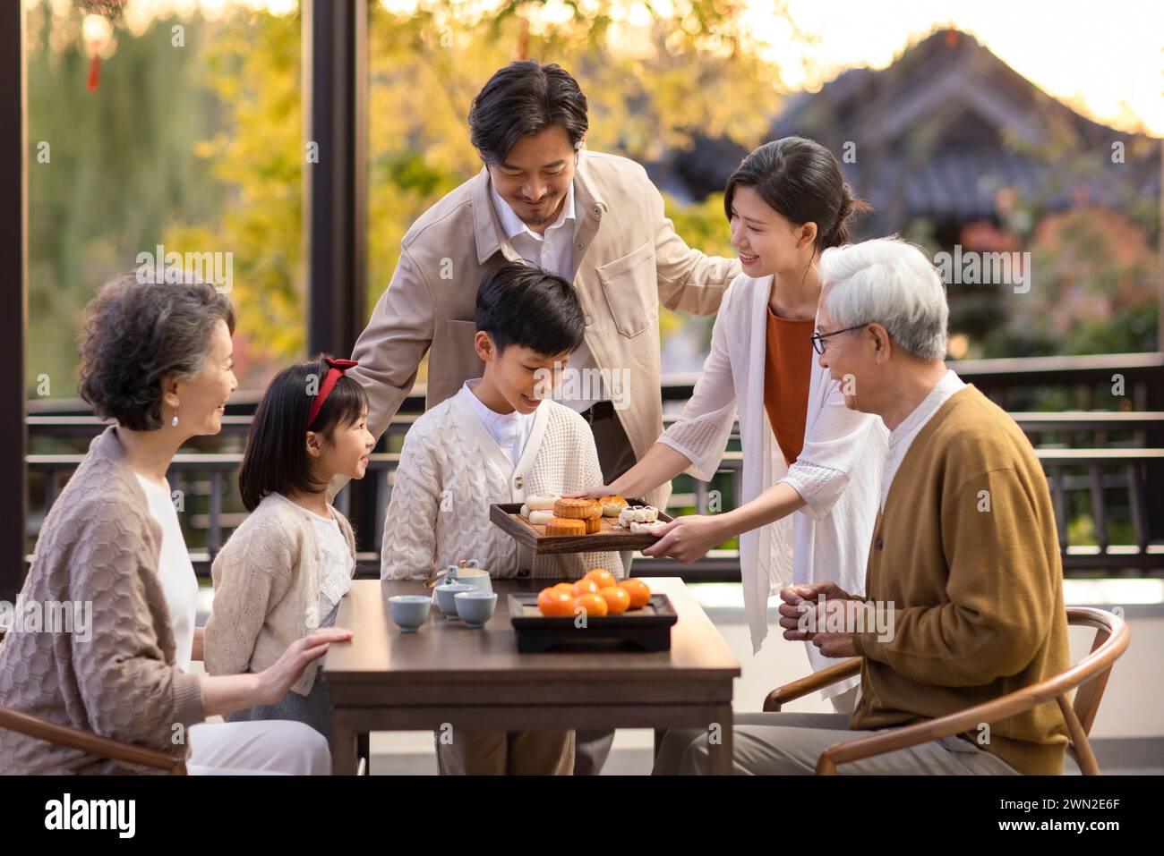Happy Family Celebrating Mid-Autumn Festival Stock Photo - Alamy
