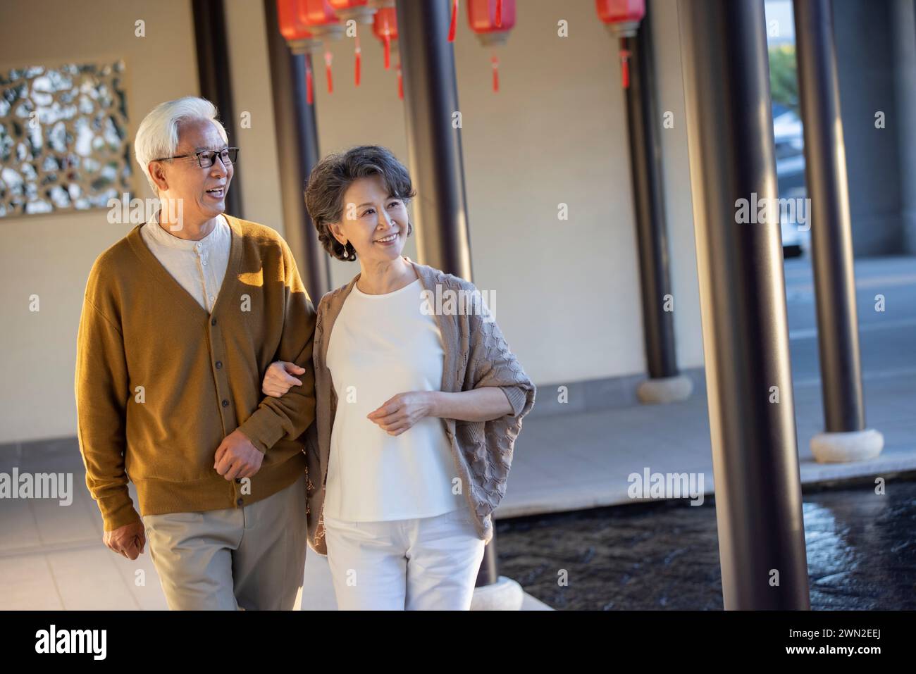 Asian couple holding hands taking hi-res stock photography and images ...