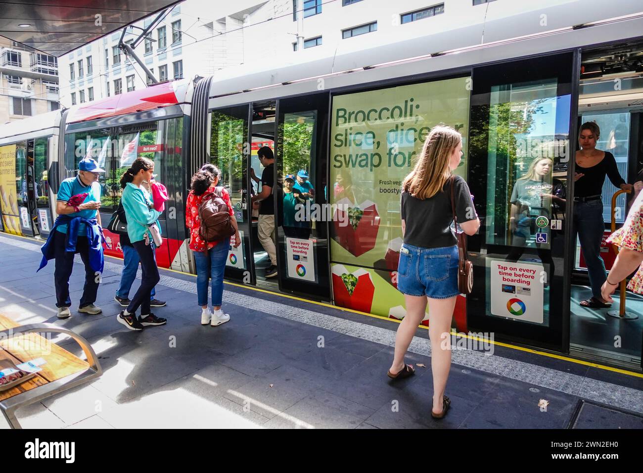 Commuters boarding the Sydney Light Rail train on George Street in ...