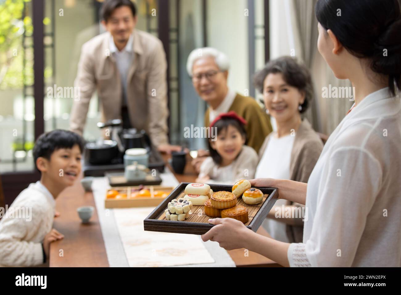 Happy Family Celebrating Mid-Autumn Festival Stock Photo - Alamy