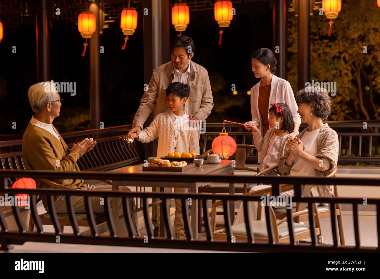Happy Family Celebrating Mid-Autumn Festival Stock Photo - Alamy