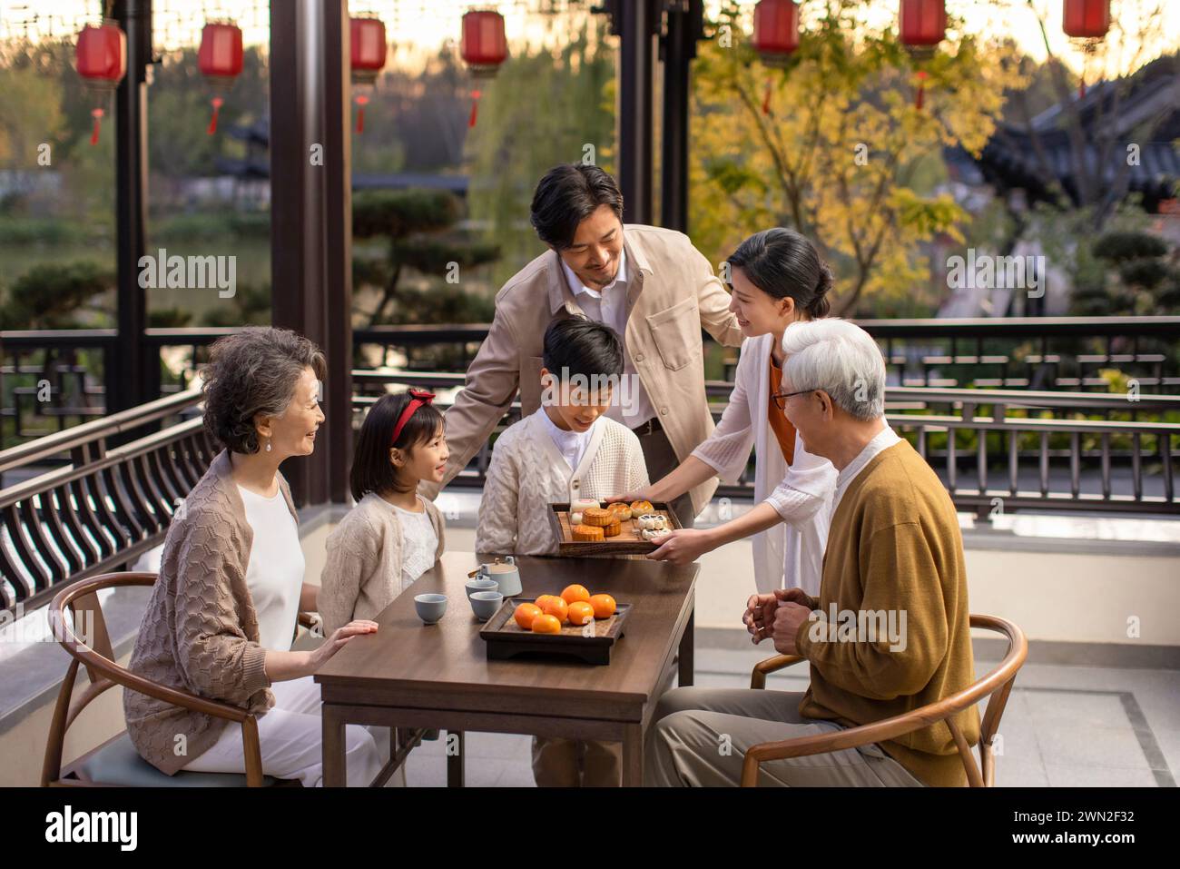 Happy Family Celebrating Mid-Autumn Festival Stock Photo - Alamy