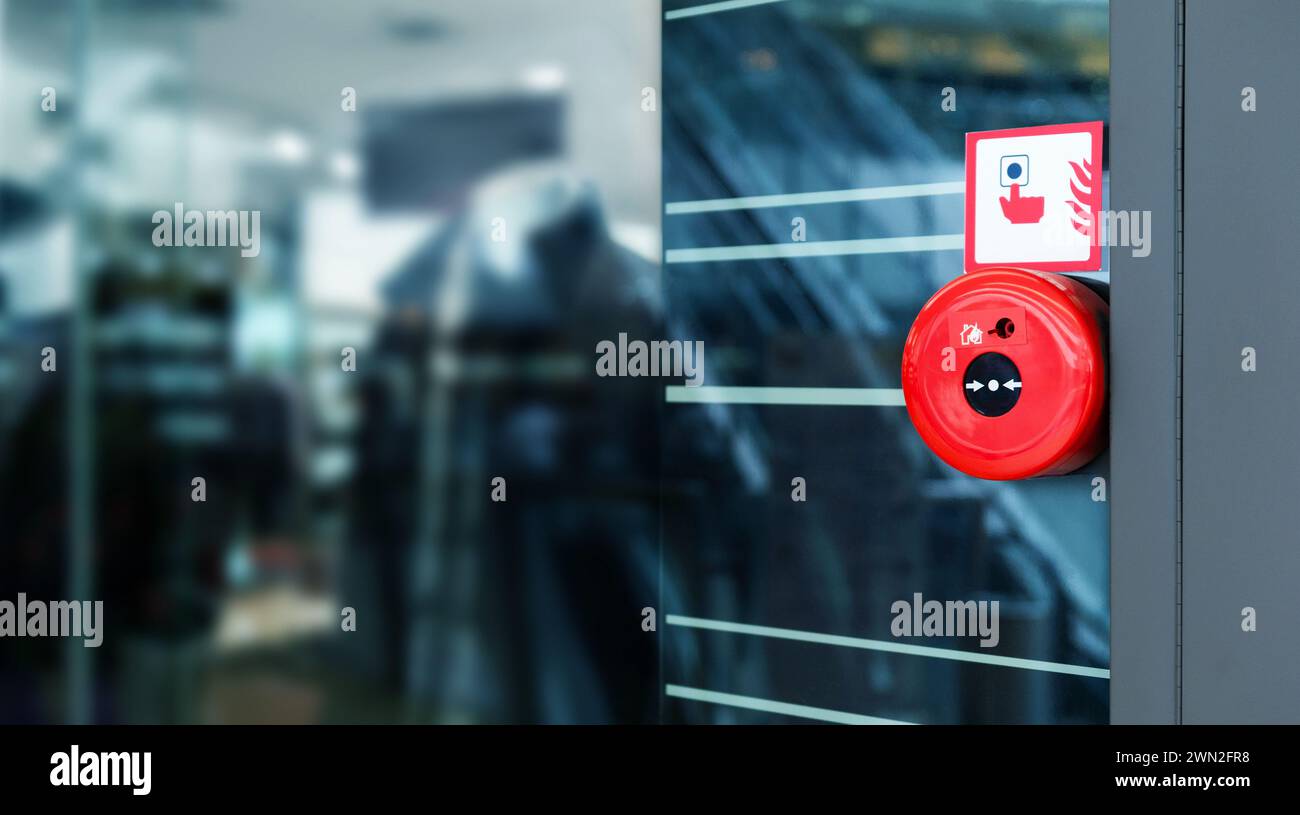 Manual push station of fire alarm system, installed on the wall of ...