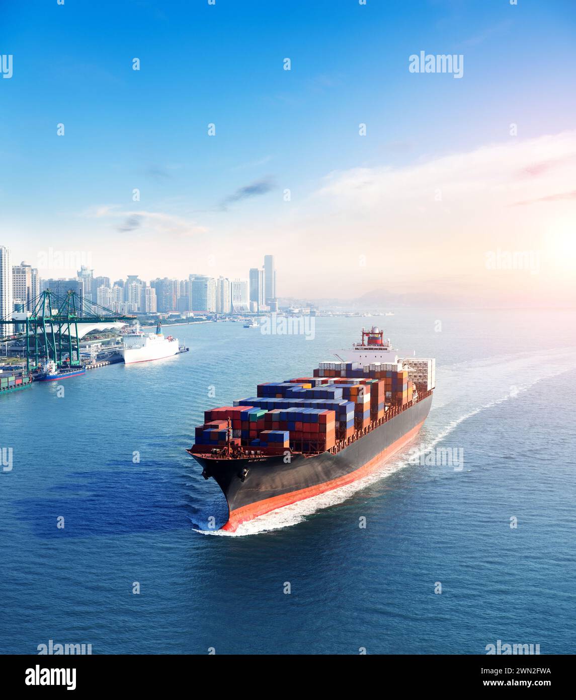 Large cargo container ship arriving in port Stock Photo - Alamy