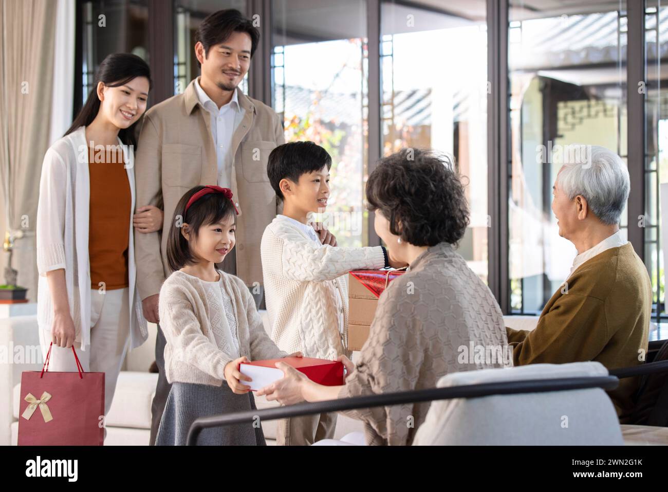 Visiting Family on Chinese New Year Stock Photo - Alamy