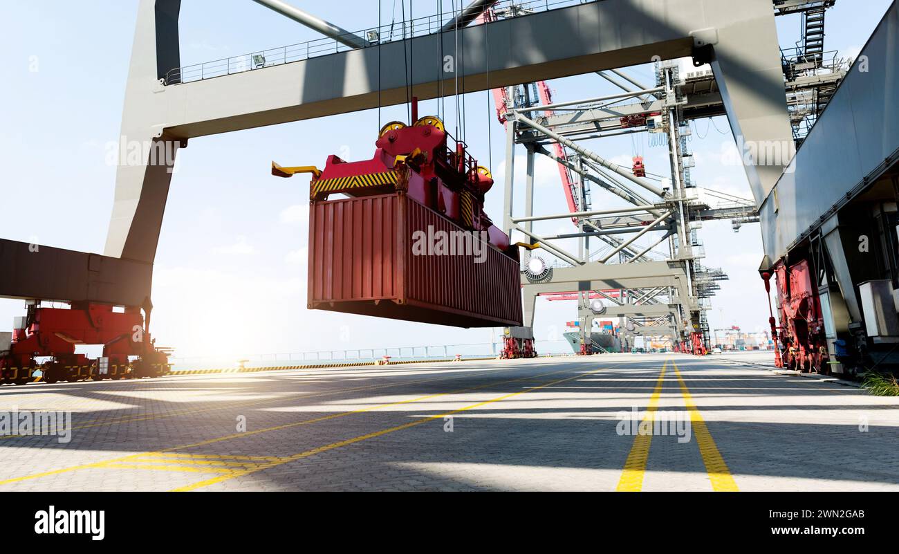 Crane unloading container in the port Stock Photo - Alamy