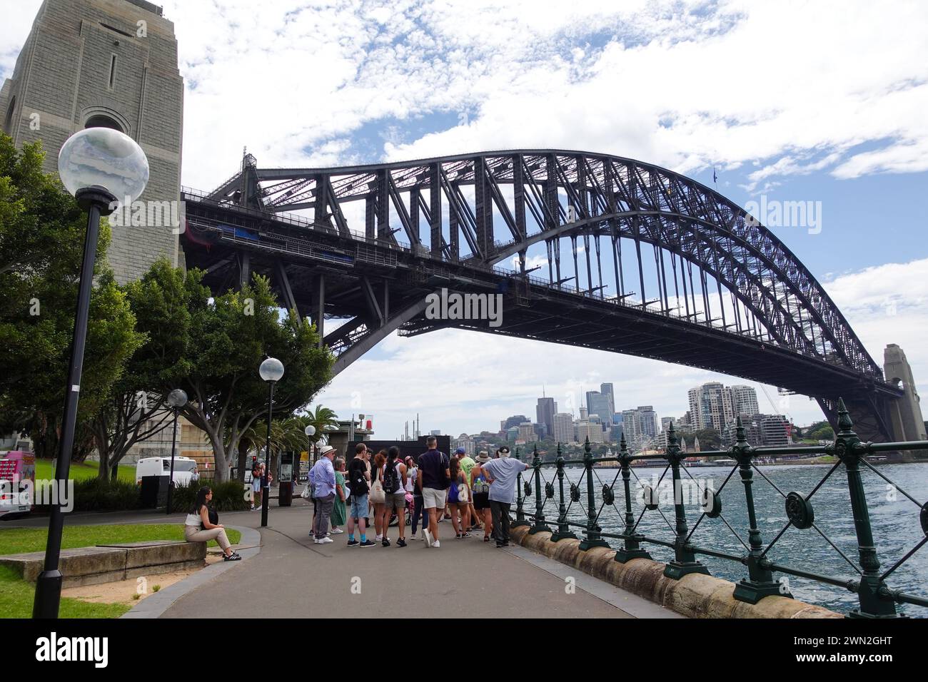 Tour guide with group of tourists near Sydney Harbour Bridge Stock ...