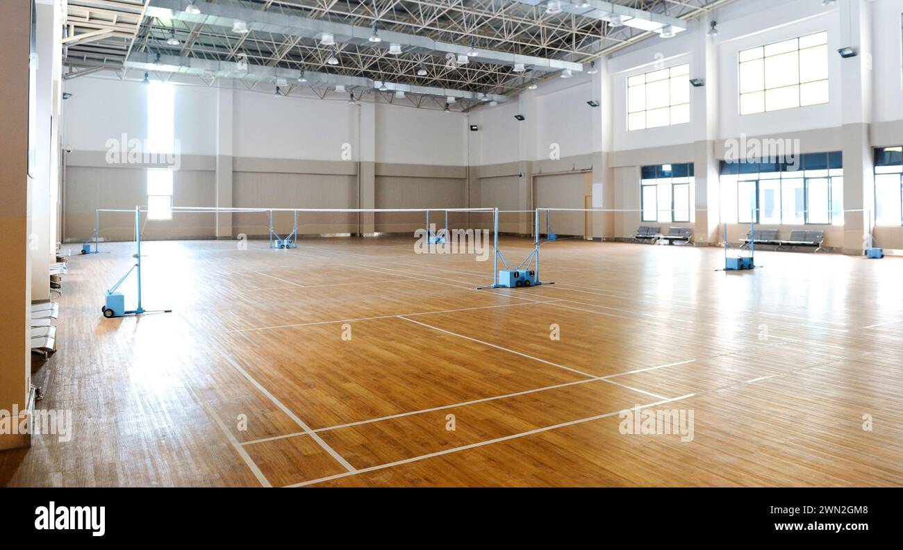 Interior of empty indoor badminton court Stock Photo - Alamy