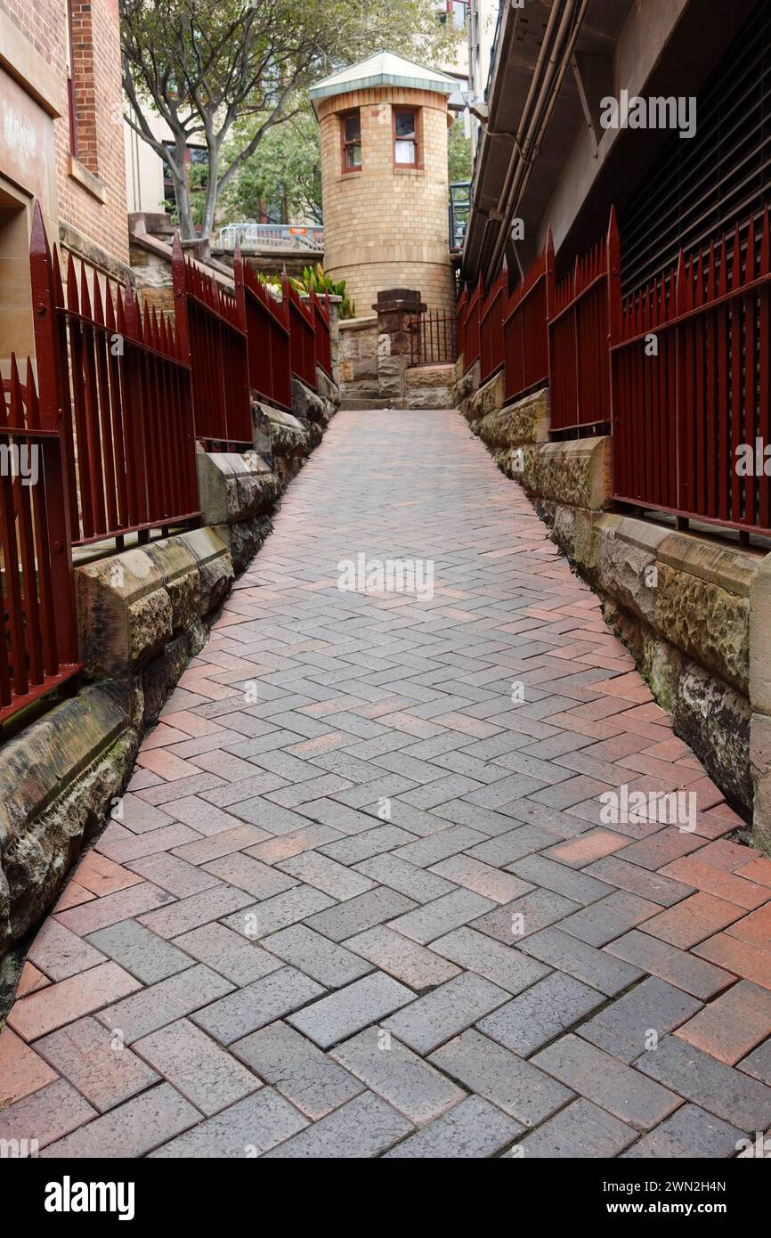 a narrow red brick pathway Stock Photo - Alamy