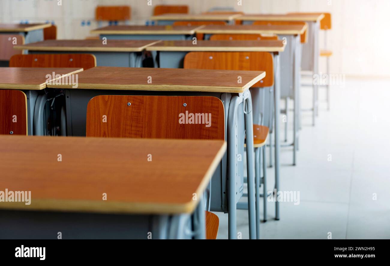 Empty classroom with chairs and desks in a line Stock Photo - Alamy