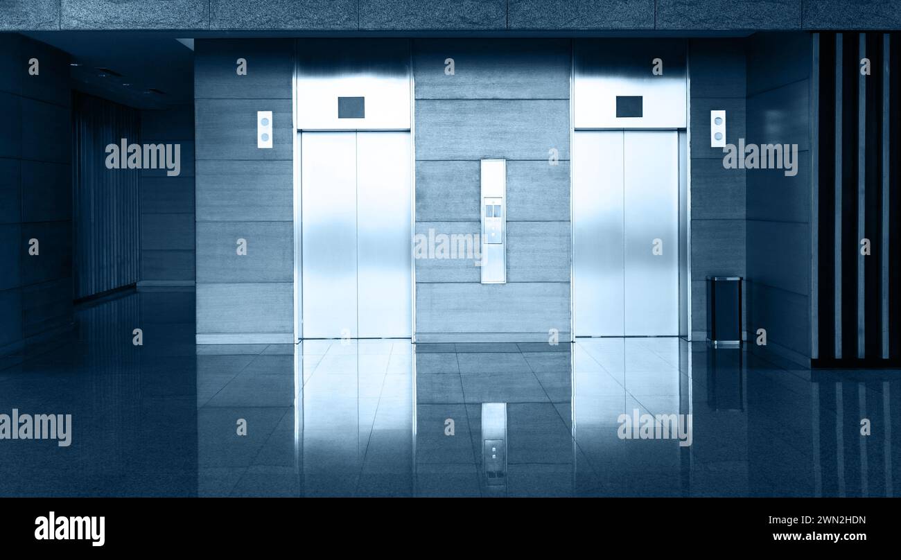 Two elevator doors in luxurious building Stock Photo - Alamy