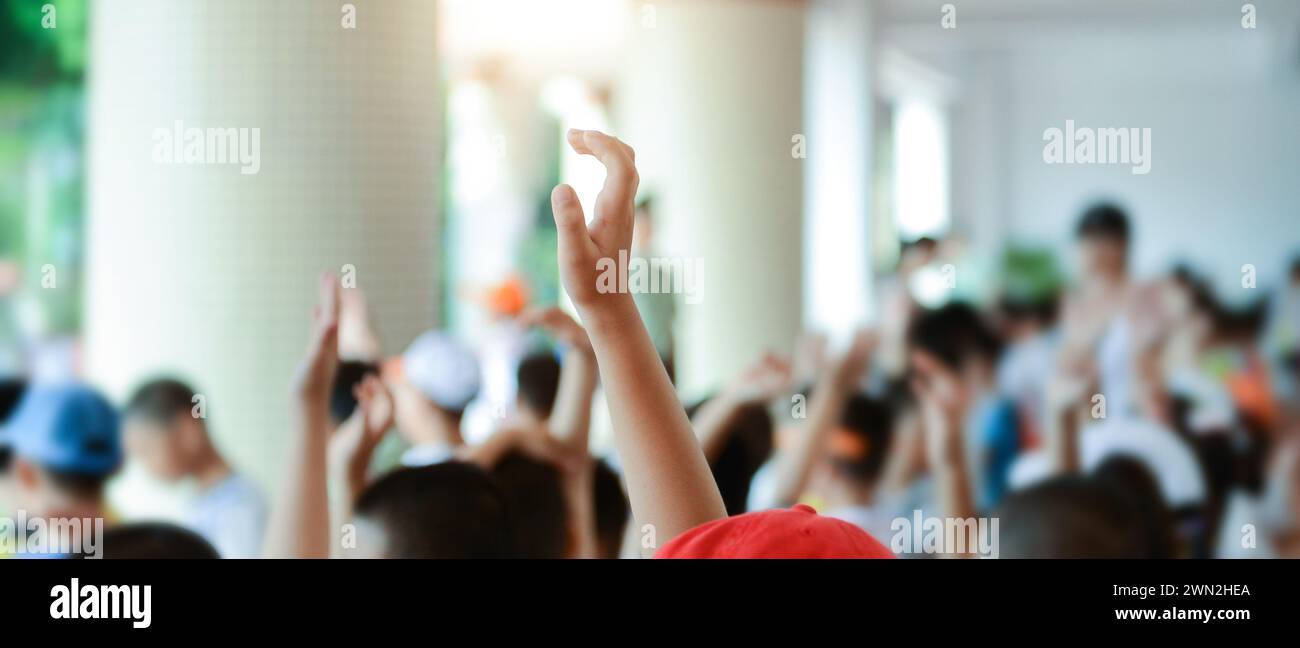 Group of happy children with their hands up Stock Photo - Alamy