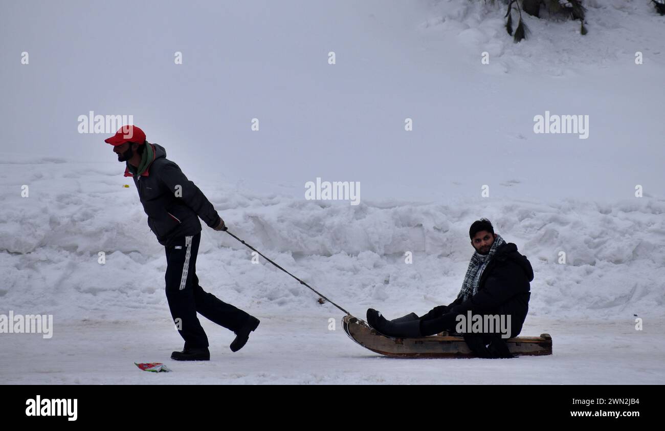 Non Exclusive: February 28, 2024, Gulmarg, India: A person pulling his ...