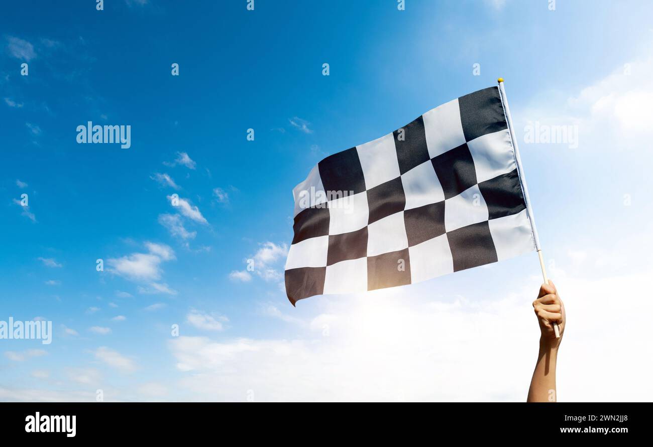 Hand waving finish flag hi-res stock photography and images - Alamy