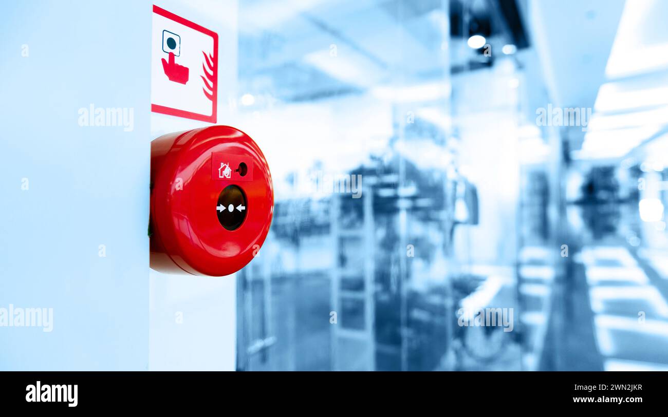 Manual push station of fire alarm system, installed on the wall of ...