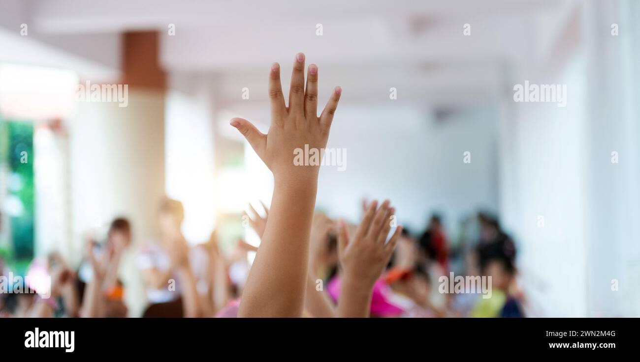 Group of happy children with their hands up Stock Photo - Alamy
