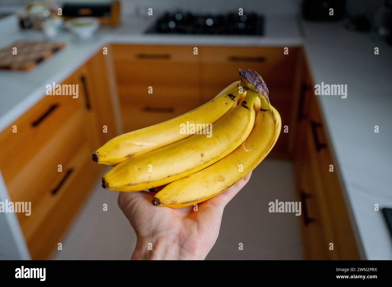Hand of bananas hi-res stock photography and images - Alamy