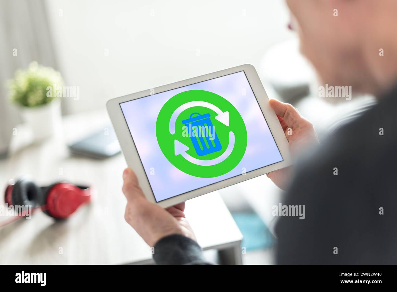 Tablet screen displaying a recycling concept Stock Photo - Alamy