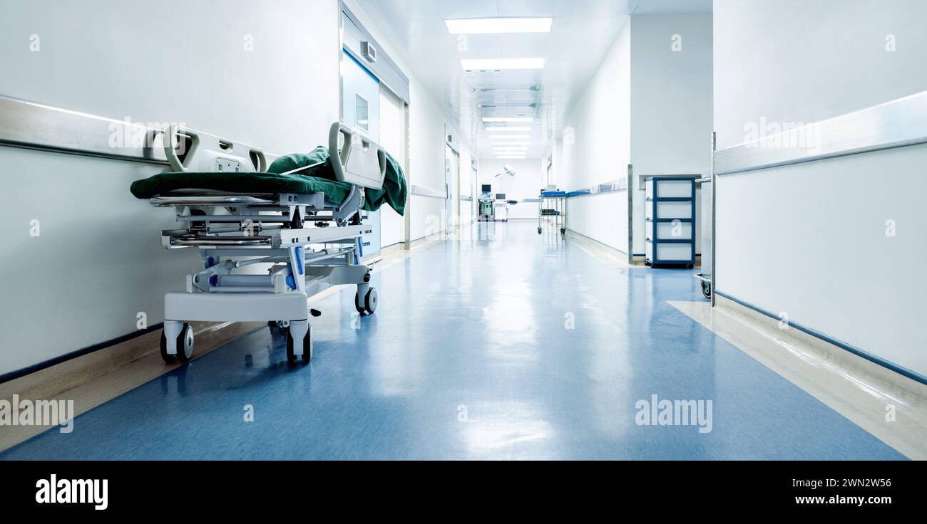 Empty hospital hallway with bed Stock Photo - Alamy