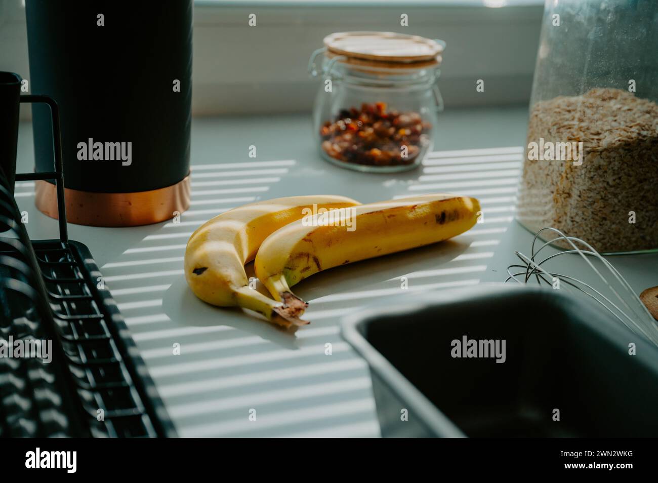 Preparing for a delicious treat: Banana bread setup in a well-lit ...