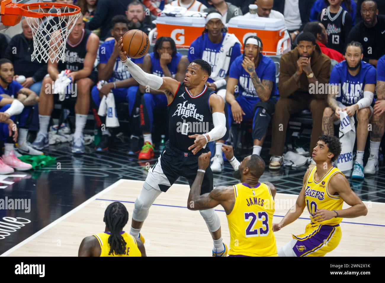 Los Angeles, USA. 28th Feb, 2024. Los Angeles Clippers' Russell Westbrook (Top) goes to the ...