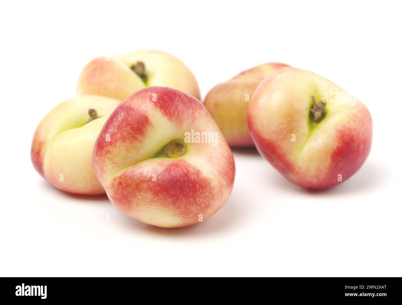 chinese flat peaches on white background Stock Photo - Alamy