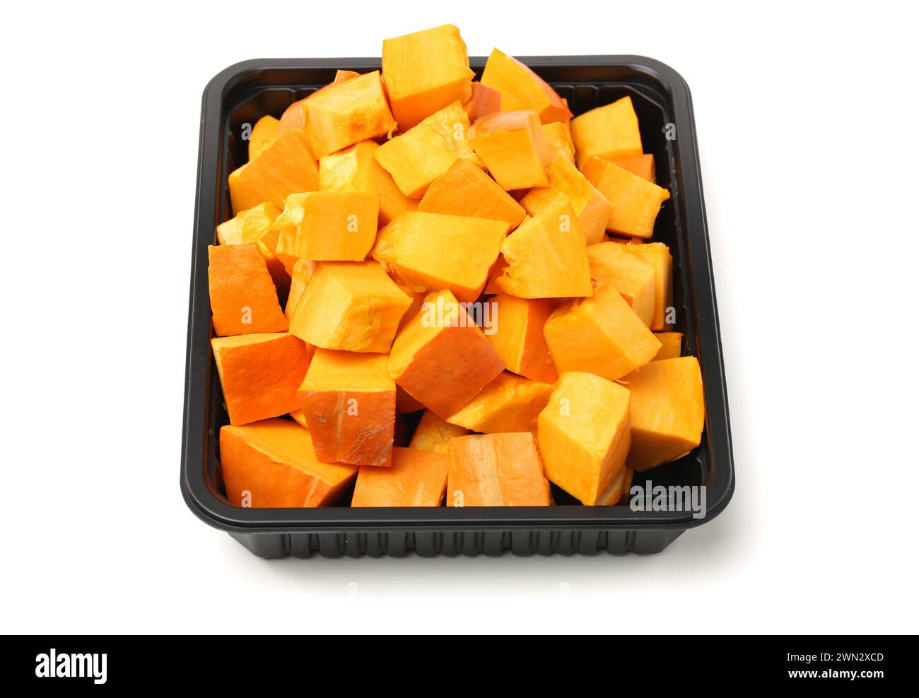 Pumpkin cubes isolated on white background Stock Photo - Alamy