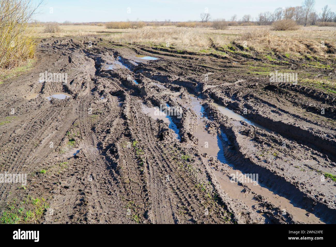 A dirty impassable country road with deep ruts Stock Photo - Alamy