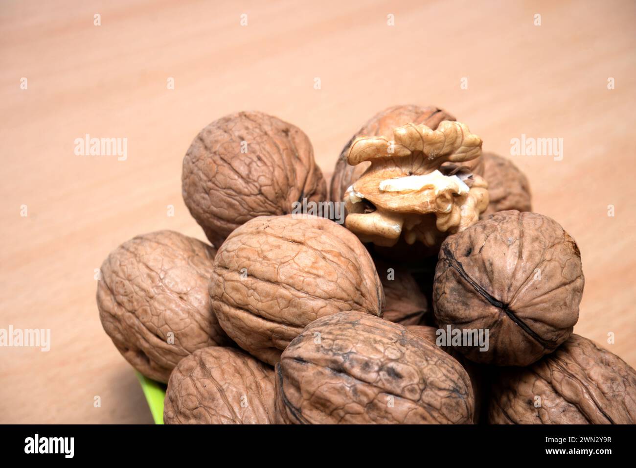 Cracked Walnut Showcasing Kernel Amidst Whole Ones, This image ...