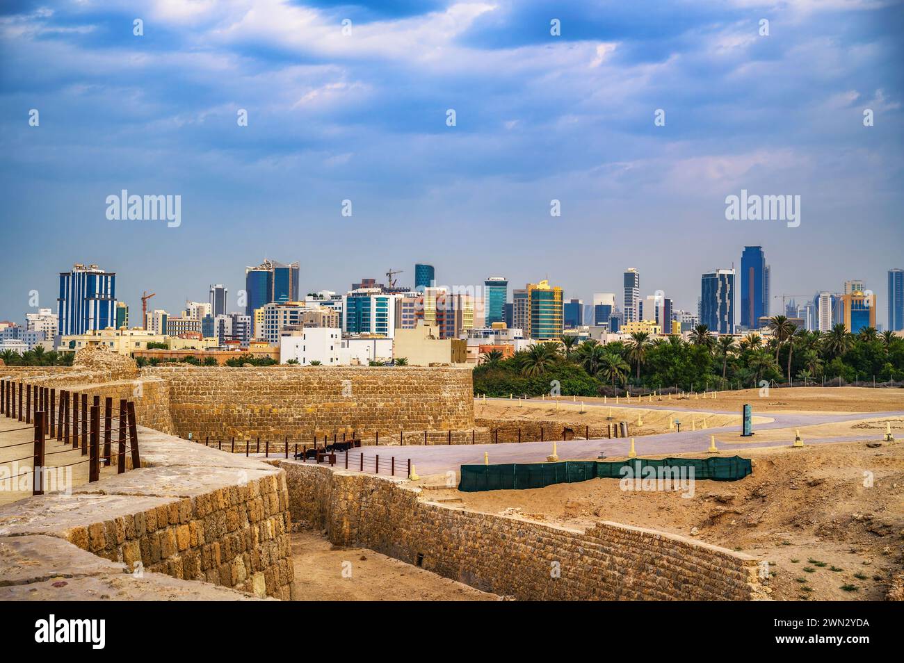 Manama skyline behind ancient Bahrain Fort Stock Photo - Alamy