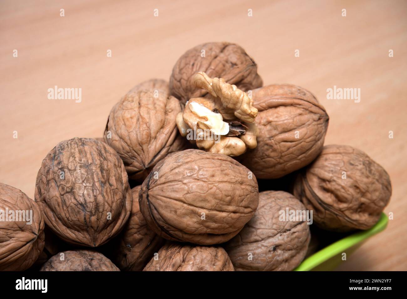 Cracked Walnut Revealing Edible Seed Amidst Whole Ones, This image ...