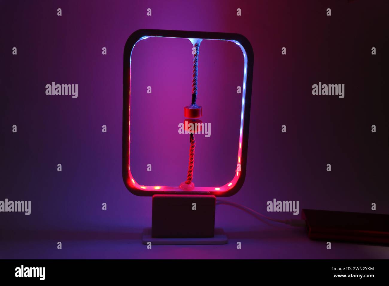 Modern desk lamp emitting rgb colors. Gradient light illuminated from a ...