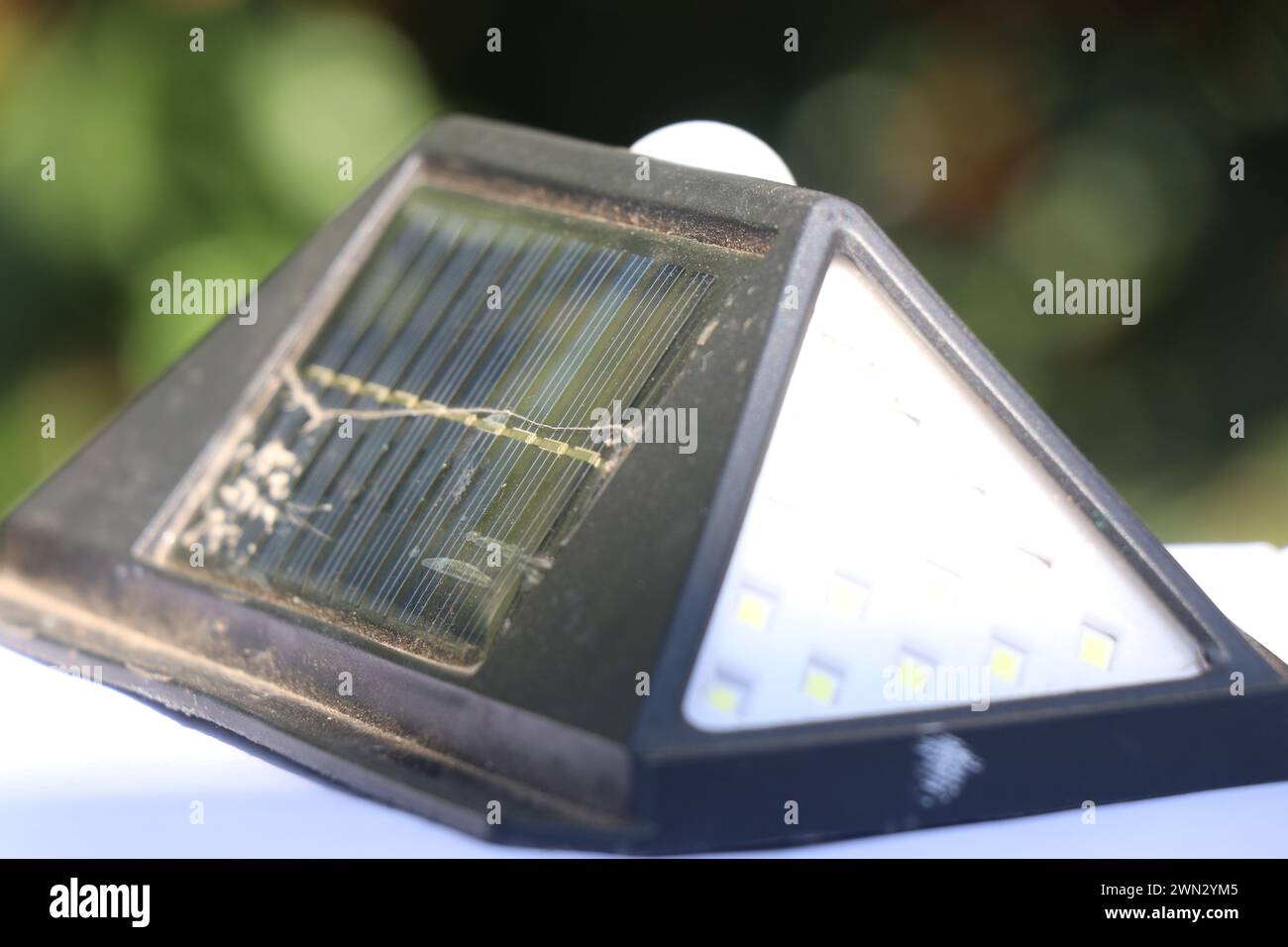 Solar panel side view from a small garden lamp that lights up ...