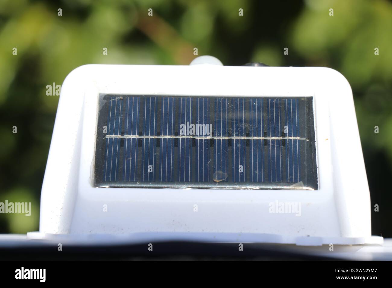 Solar light charging on outdoor light. Solar panel charging the ...
