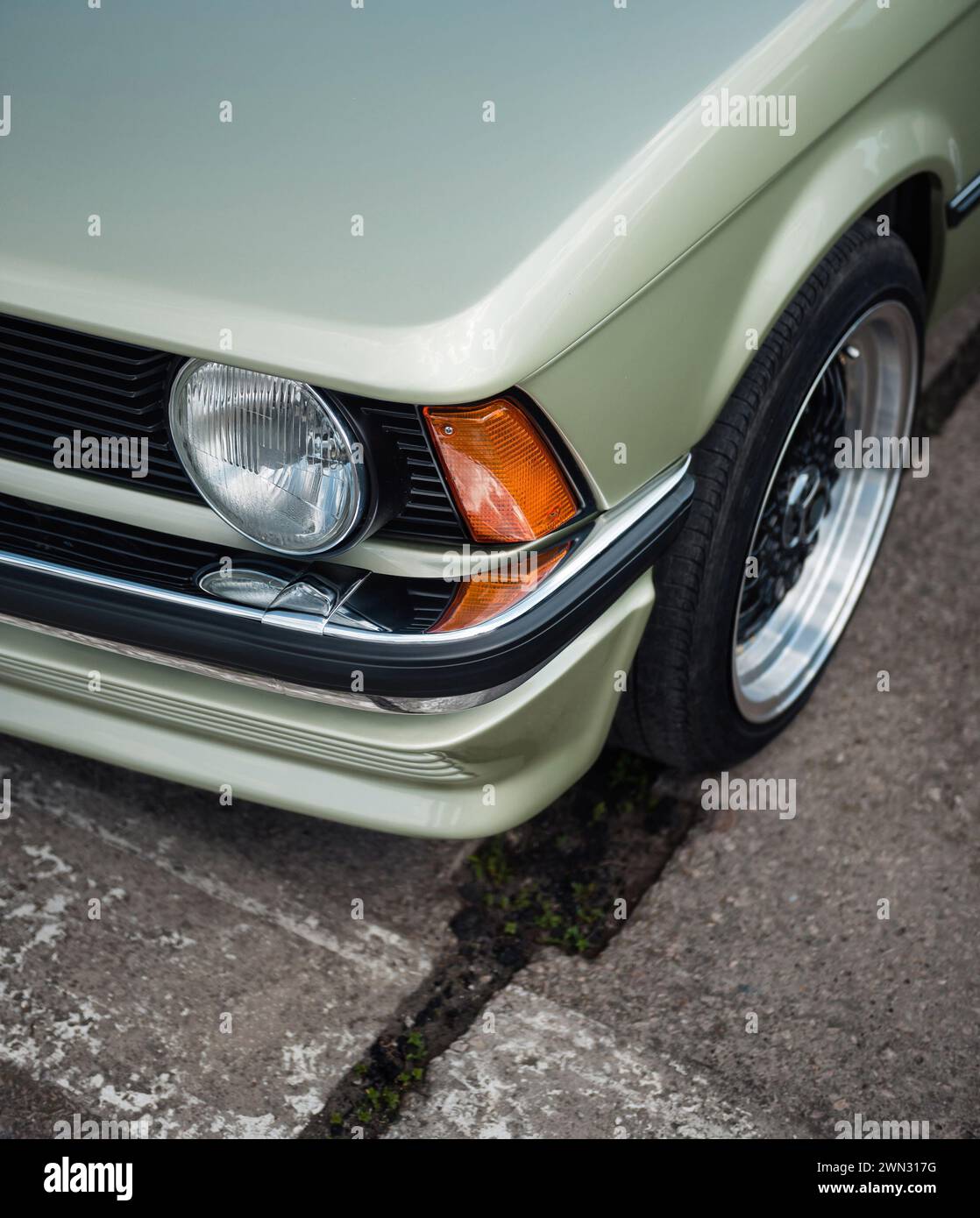 Front left corner of old light green 1970s car. Classic car parked on ...