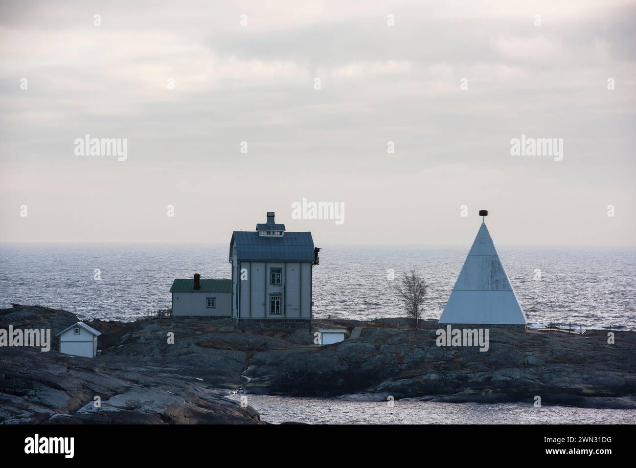 A House and a lighthouse on KOBBA KLINTAR in the Aland archipelago ...