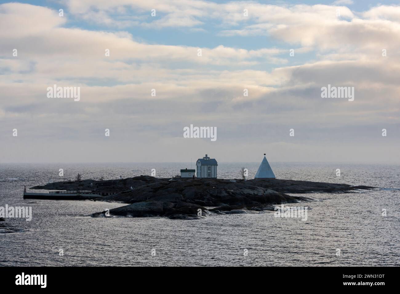 House and a lighthouse on KOBBA KLINTAR in the Aland archipelago ...