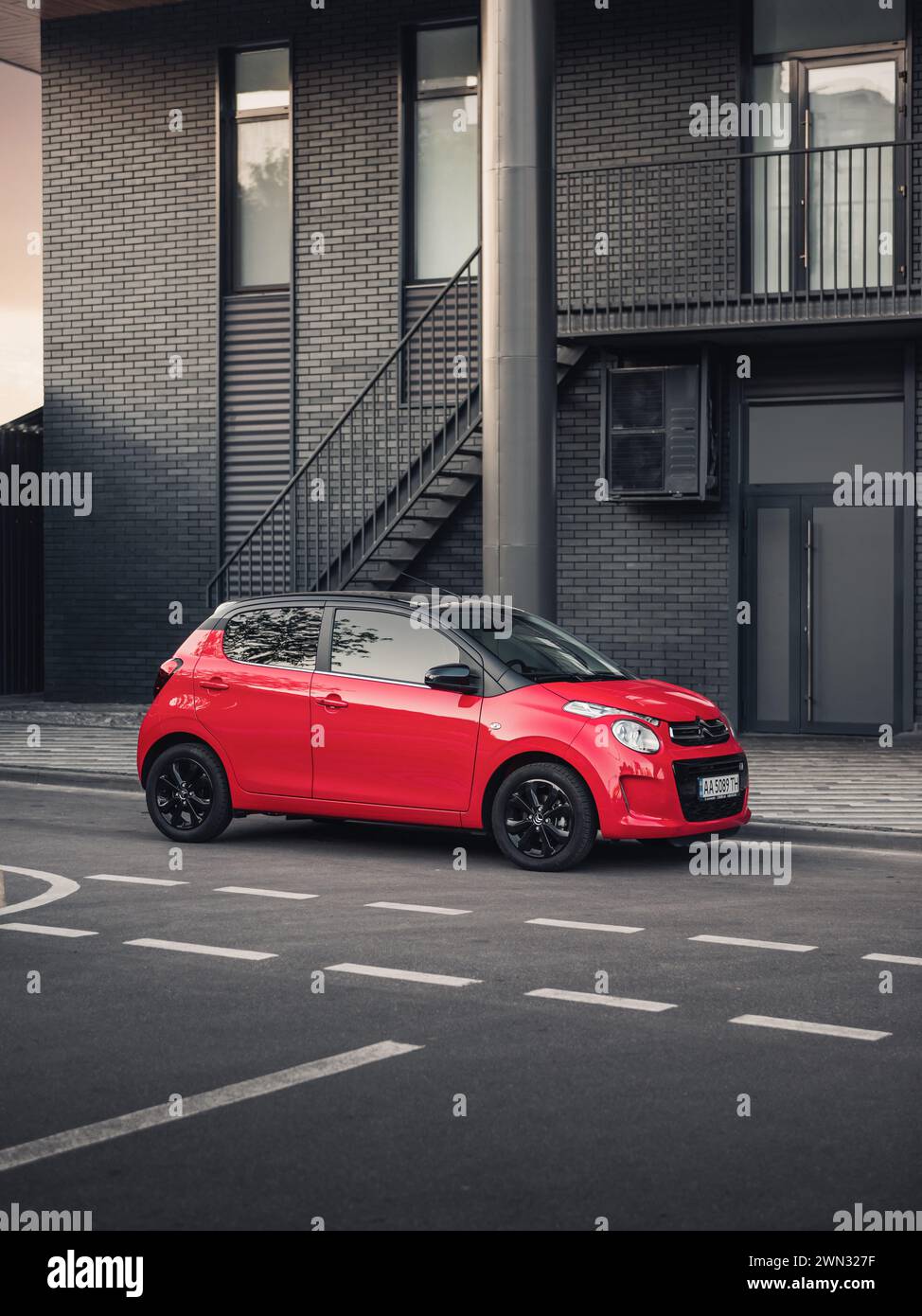 Citroen C1 in front of modern building. Front three quarter view of ...