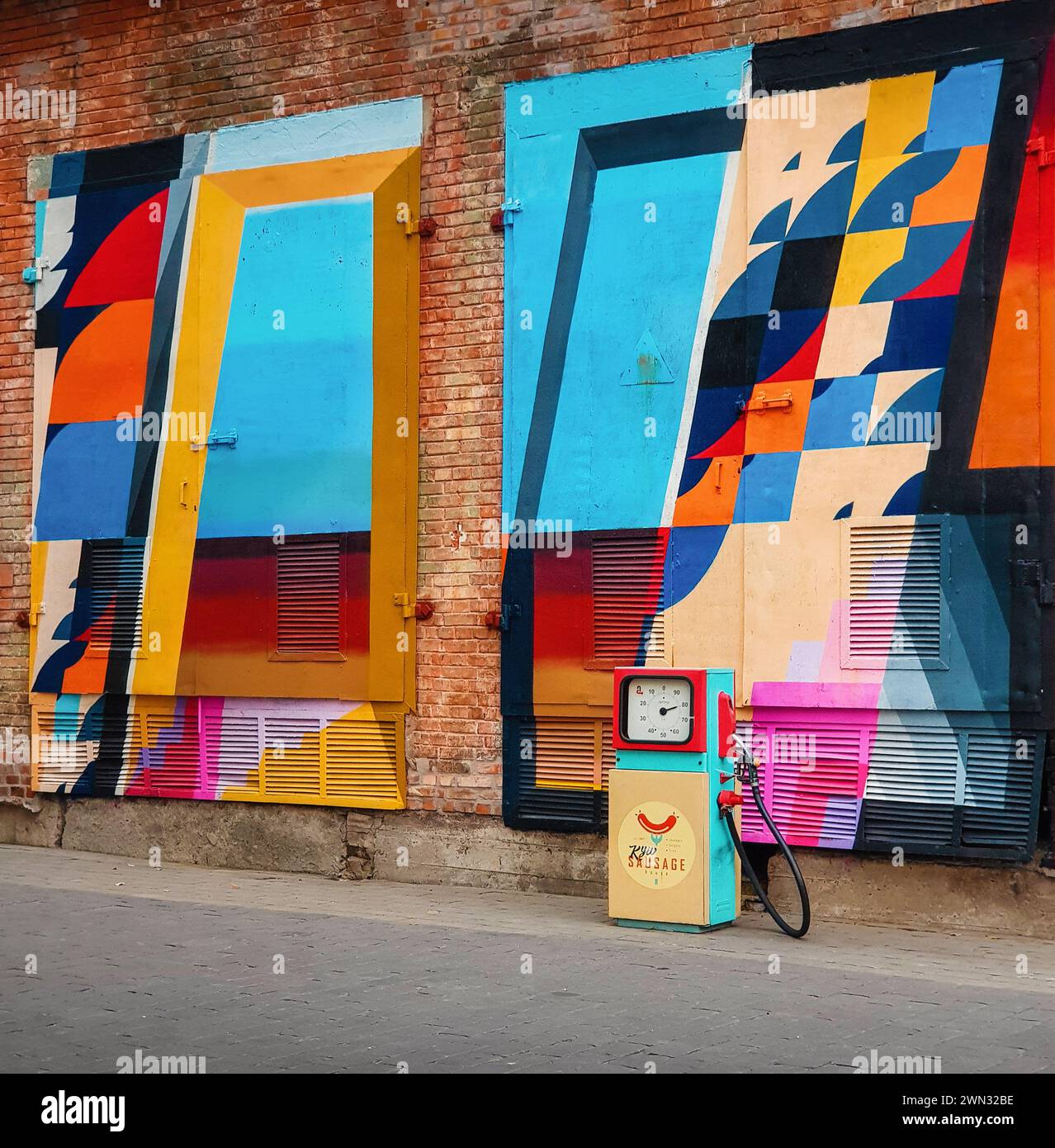 street art on the wall of old factory. brick factory facade with ...